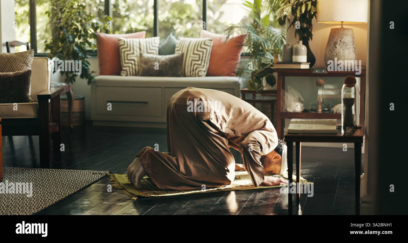 Muslim, man and praying bow in islam at house for spiritual worship ...