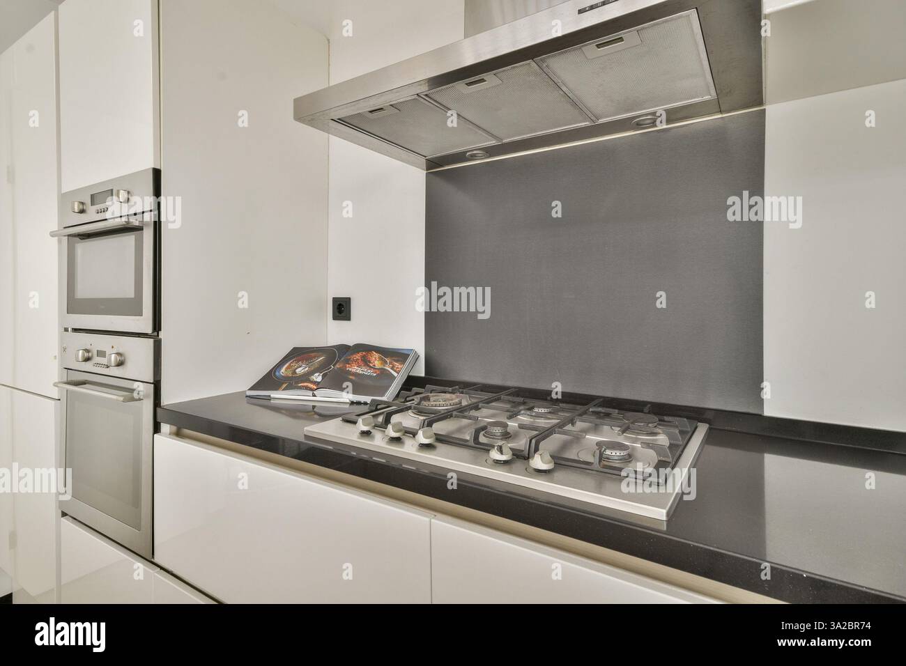 Elegant kitchen design featuring stainless steel appliances, a sleek ...