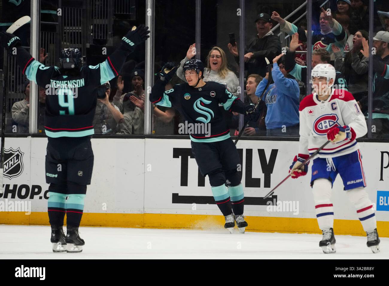 Seattle Kraken right wing Jani Nyman, center, celebrates his first NHL ...