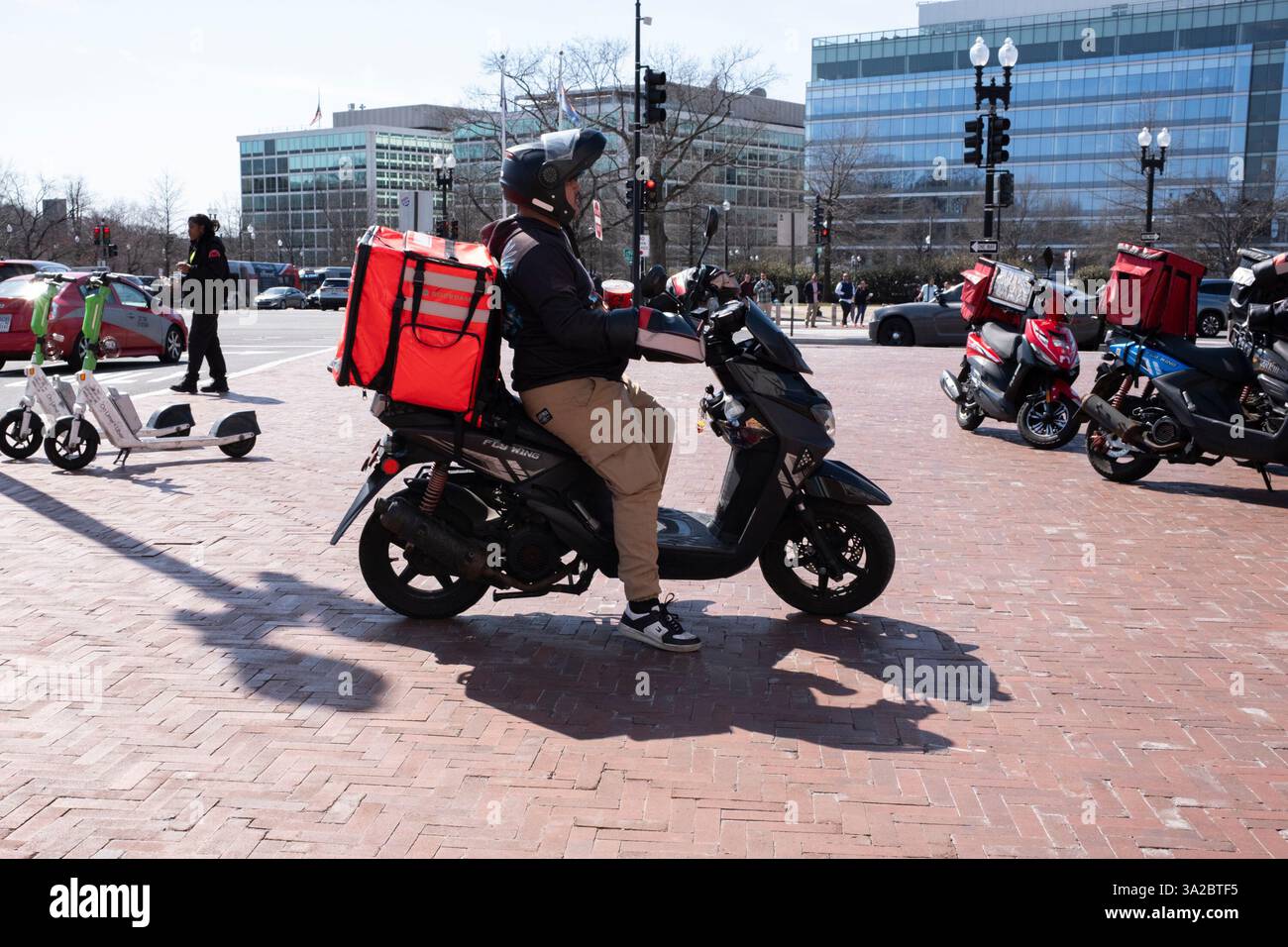 An app-based food delivery worker is seen near the Union Station in ...