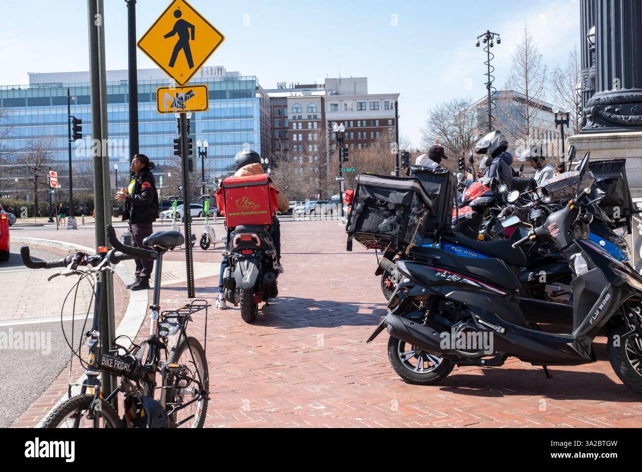 App-based food delivery workers are seen near the Union Station in ...