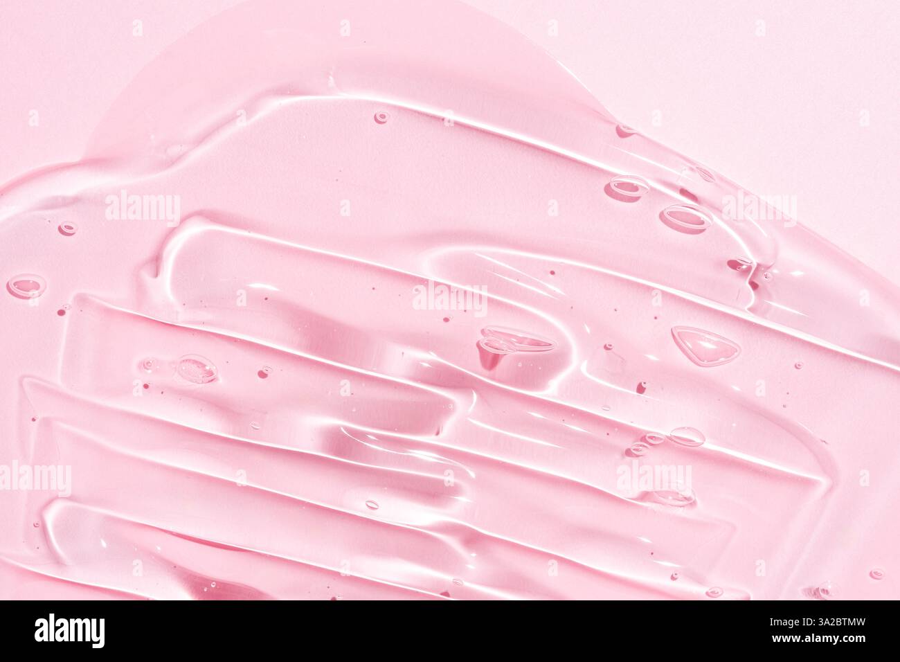 A macro shot with details and patterns of a soothing pink gel substance ...