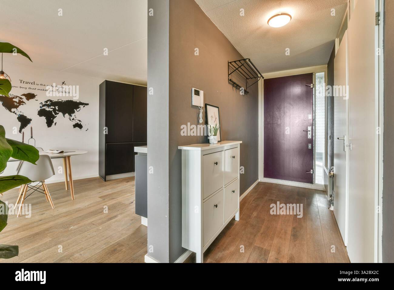 A sleek modern hallway featuring stylish furniture and decor. The space ...