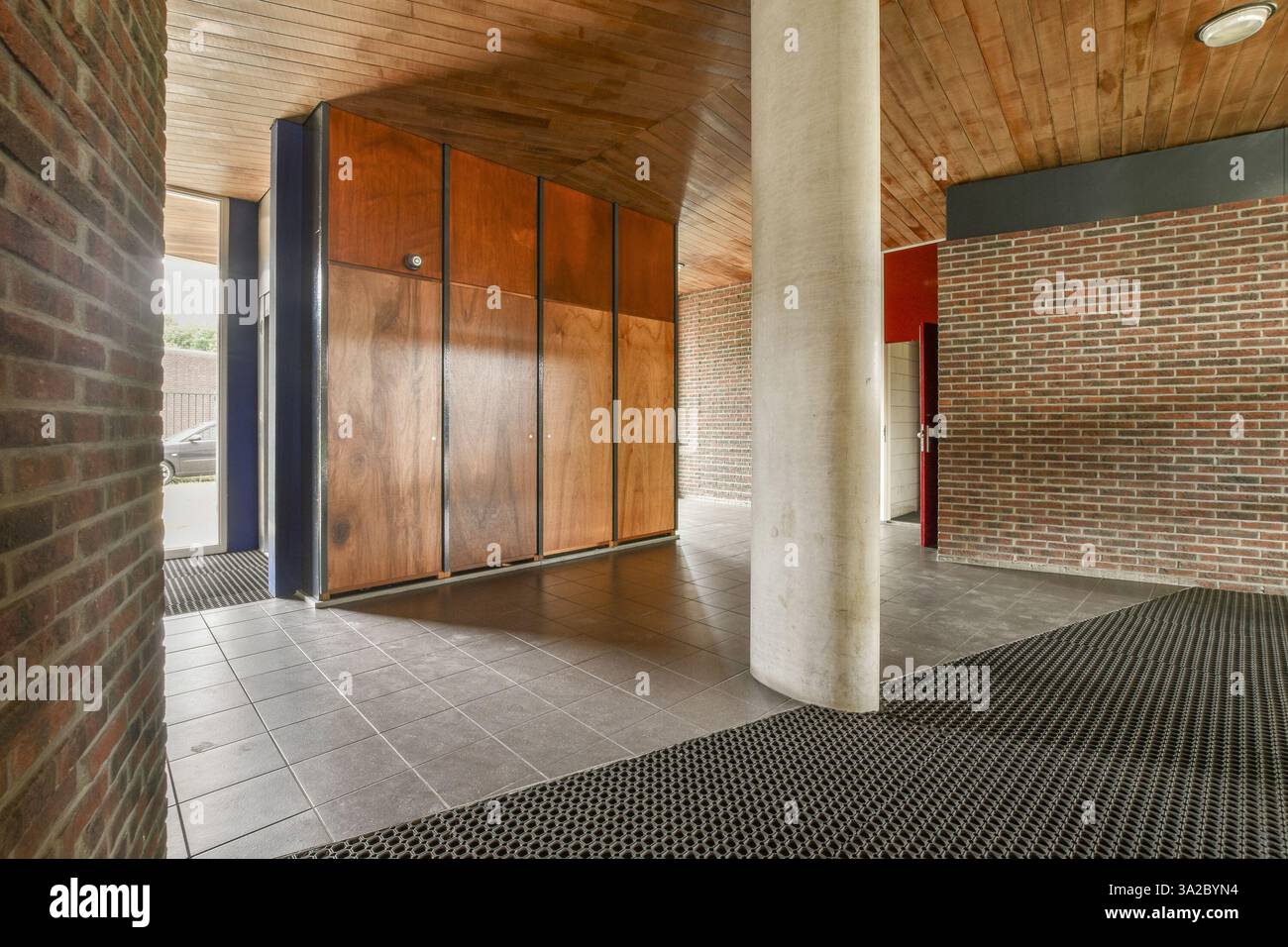 A contemporary interior space showcasing a blend of wooden and brick ...