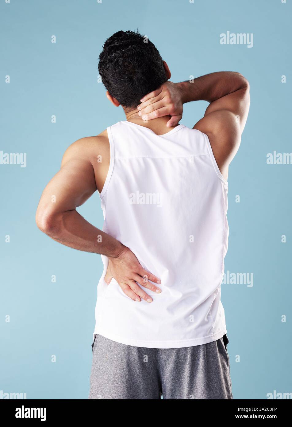 Back pain, injury and man in studio, inflammation and aching body on ...