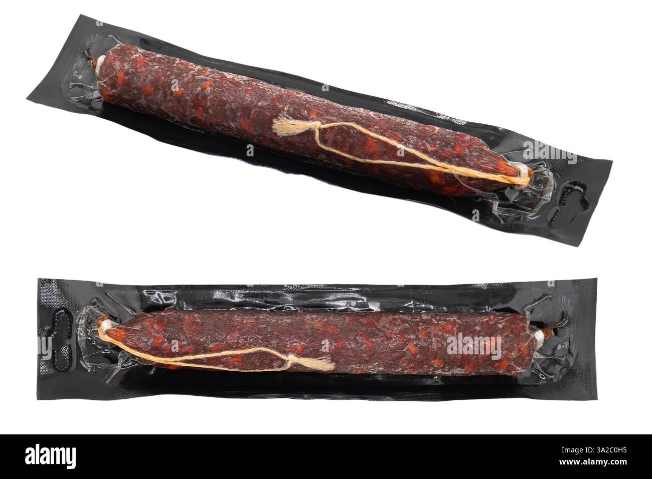 Top view of smoked meat salami in vacuum package isolated on black ...
