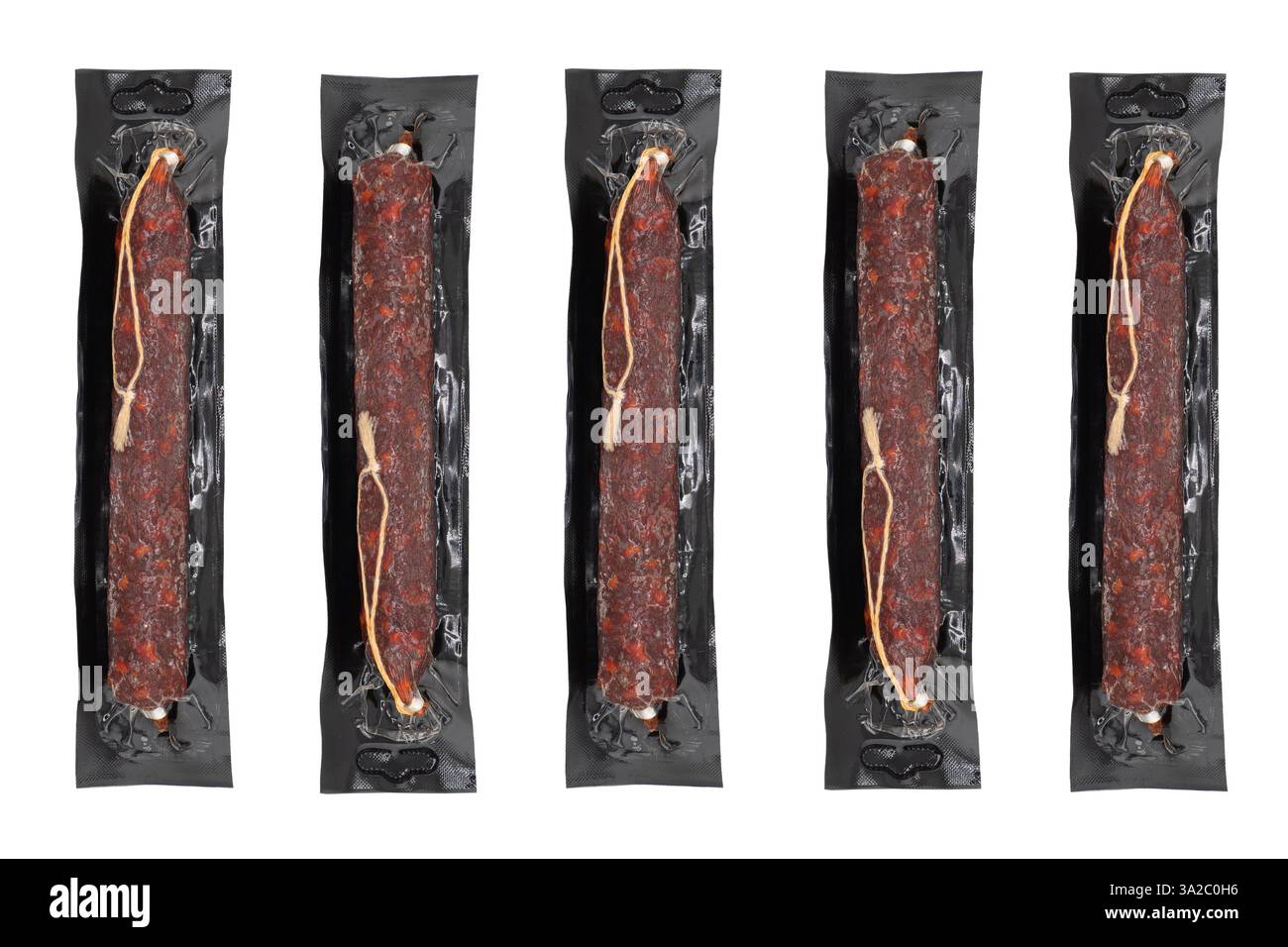 Top view of smoked meat salami in vacuum package isolated on black ...