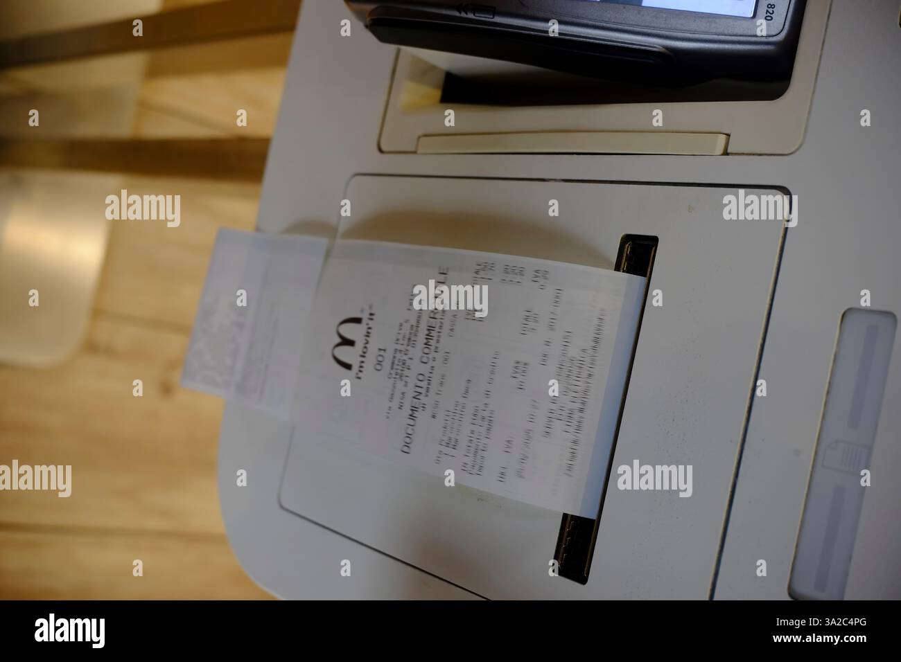 Lombardy, Italy March 1st 2025 Printing a receipt from a McDonald's ...