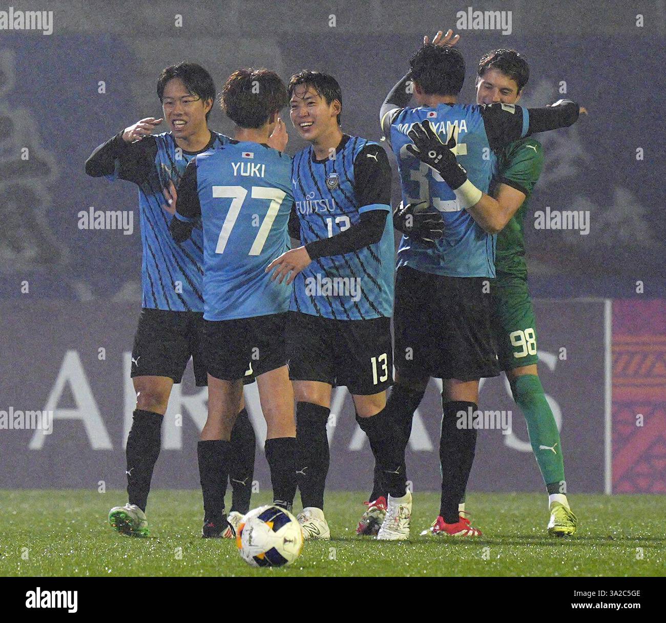 Kawasaki Frontale players celebrate after beating Shanghai Shenhua of China in an AFC Champions ...