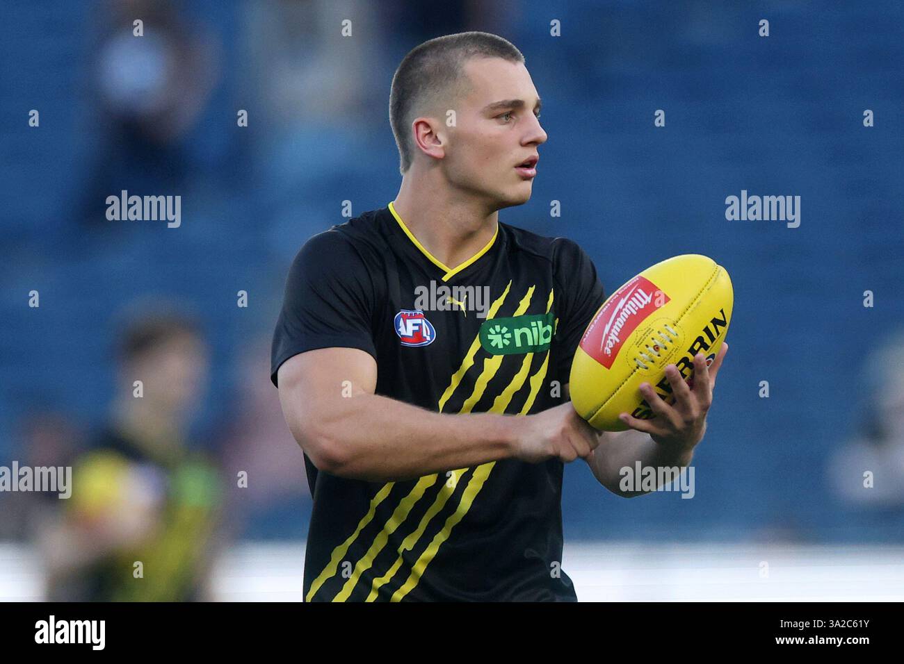 Melbourne, Australia. 13th Mar, 2025. Sam Lalor of the Tigers warms up ...