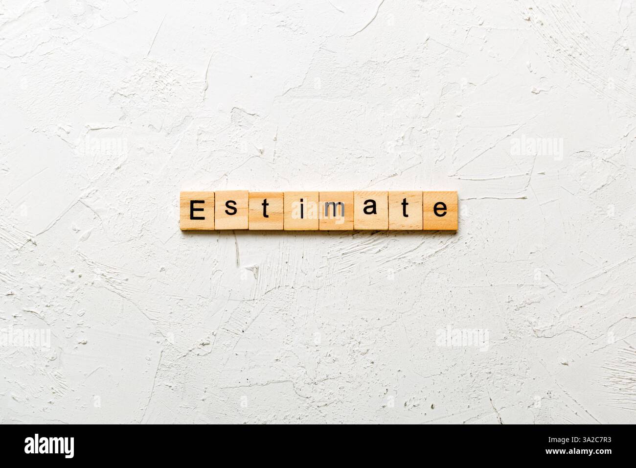 estimate word written on wood block. estimate text on table, concept ...
