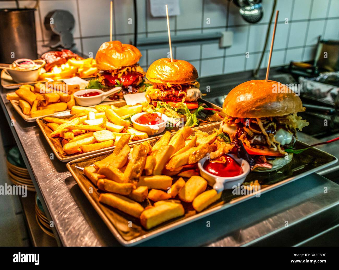 Home made hamburger with lettuce, cheese, beef meat and french fries ...