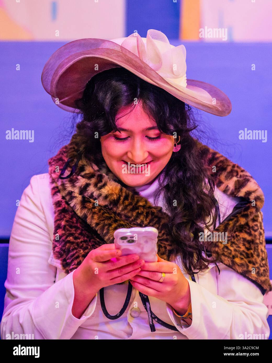 London, UK. 12th Mar, 2025. A few members of the audience came in ...