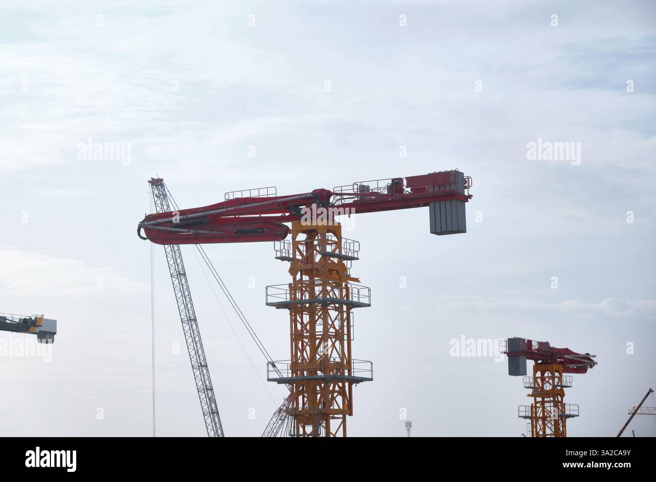 Concrete placing boom at construction site Stock Photo - Alamy
