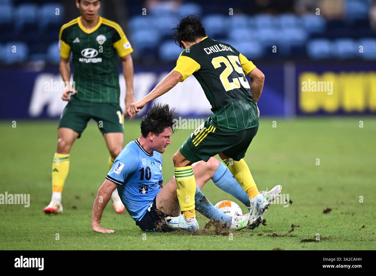 Joe Lolley of Sydney is tackled by Choi Chul Soon of Jeonbuk during the ...