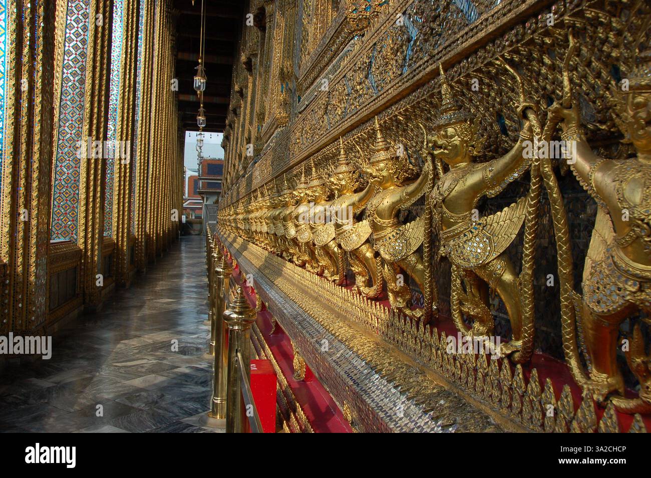 Golden Garuda statues line the ornately decorated walls of the Grand ...