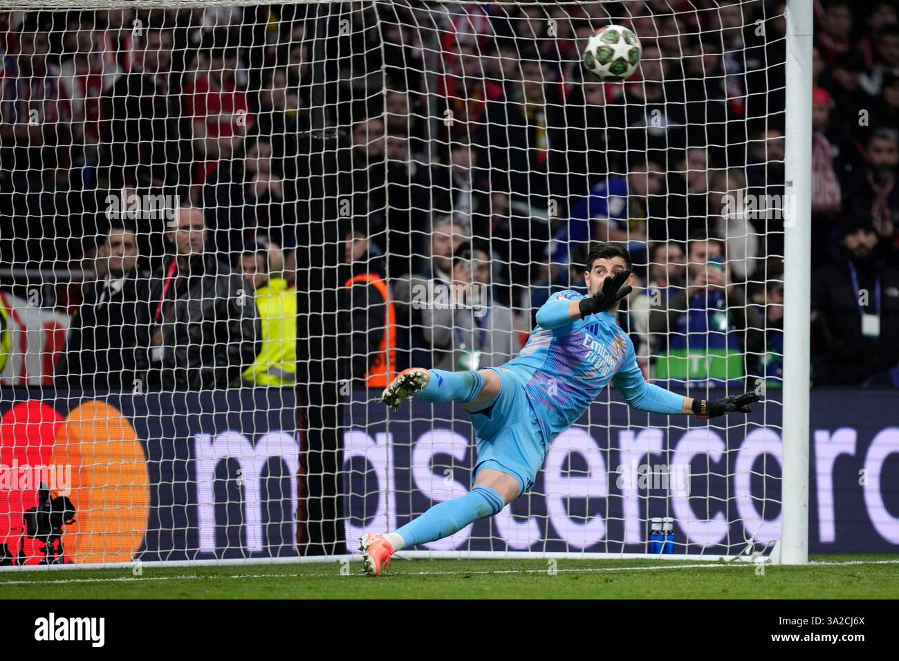 Real Madrid goalkeeper Thibaut Courtois fails to stop a penalty kick by ...