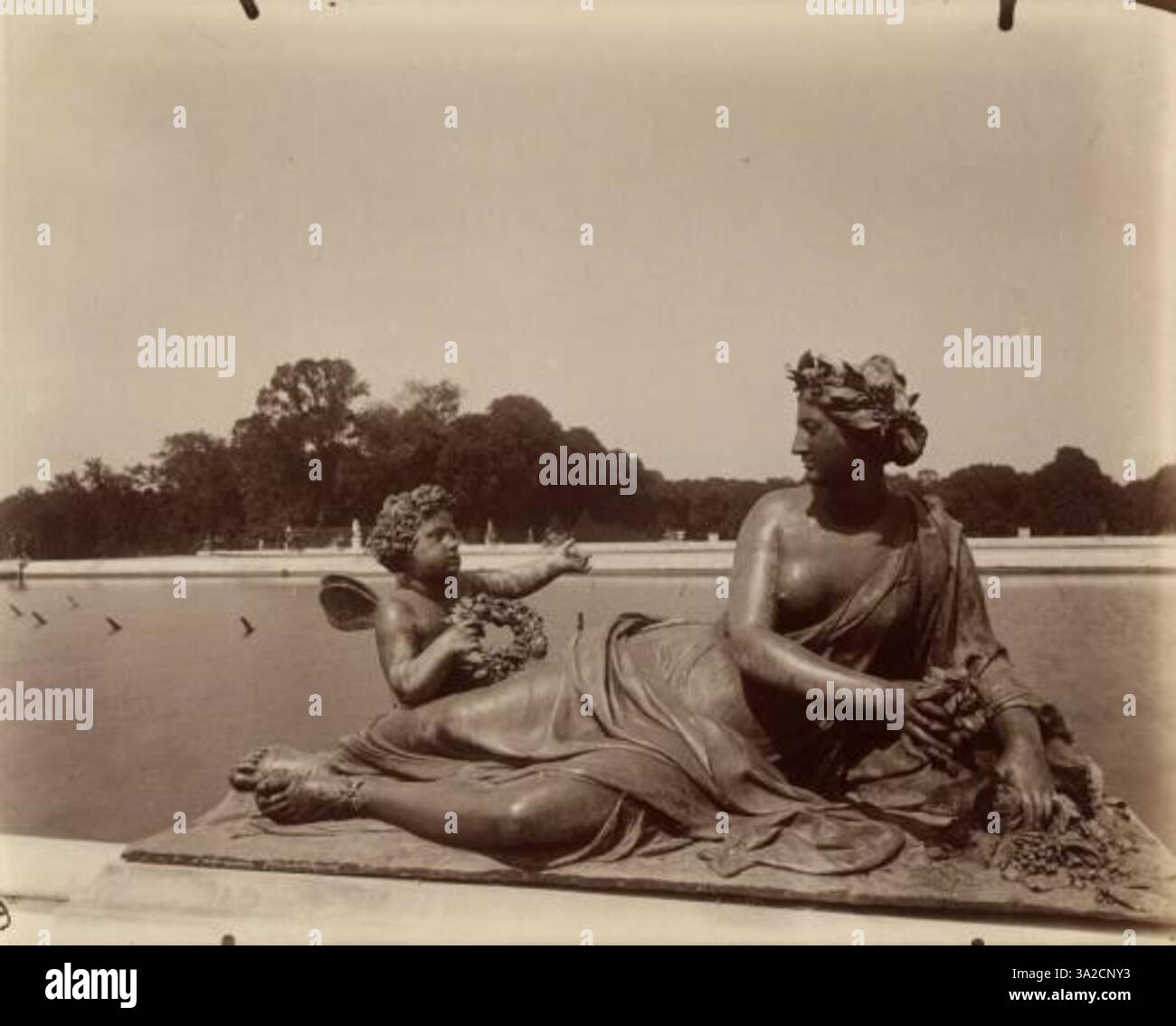 Atget captures the expanse of the Versailles Park, with its ...