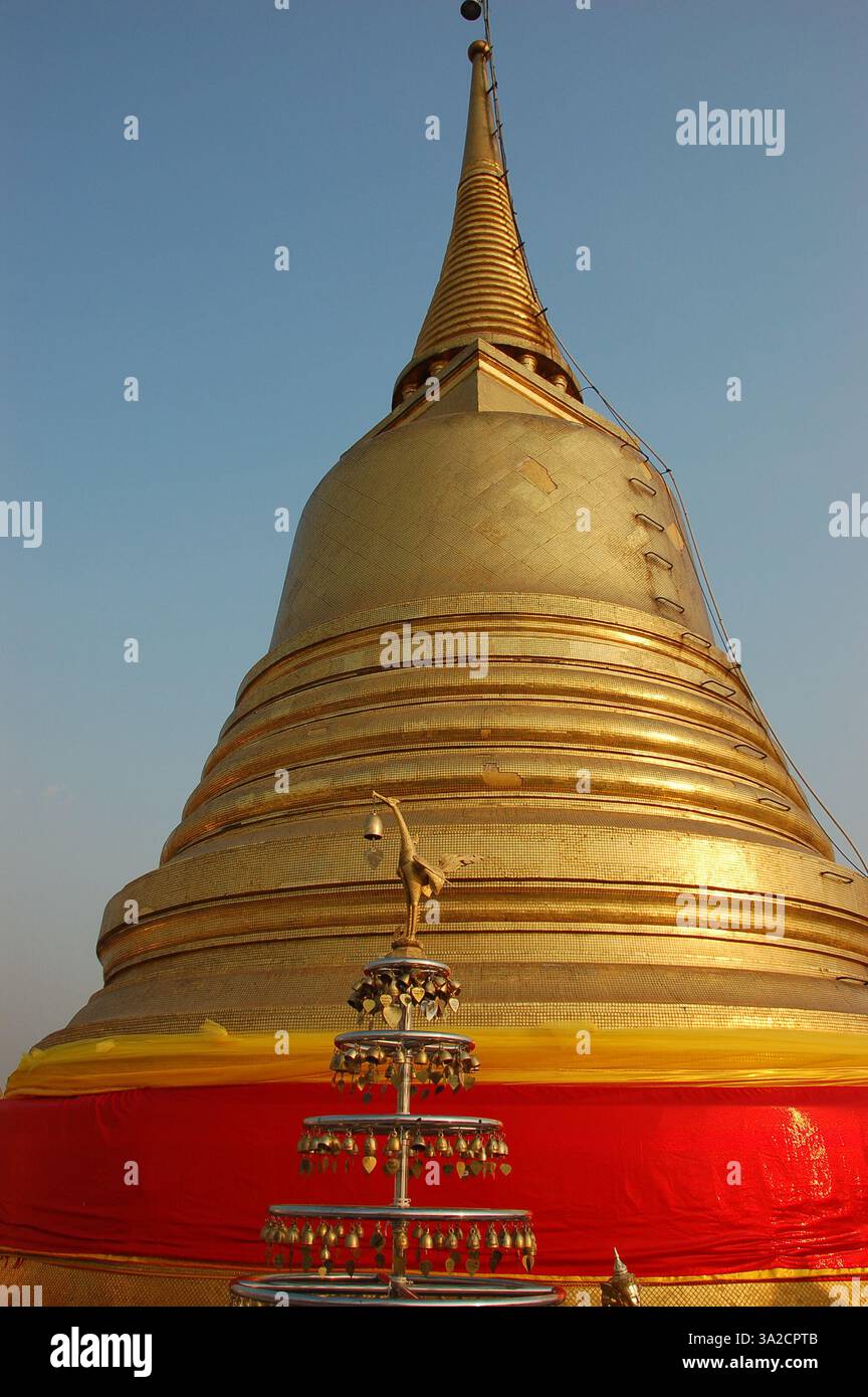 The golden stupa of Wat Saket, also known as the Golden Mount, in Bangkok, Thailand, shimmering ...