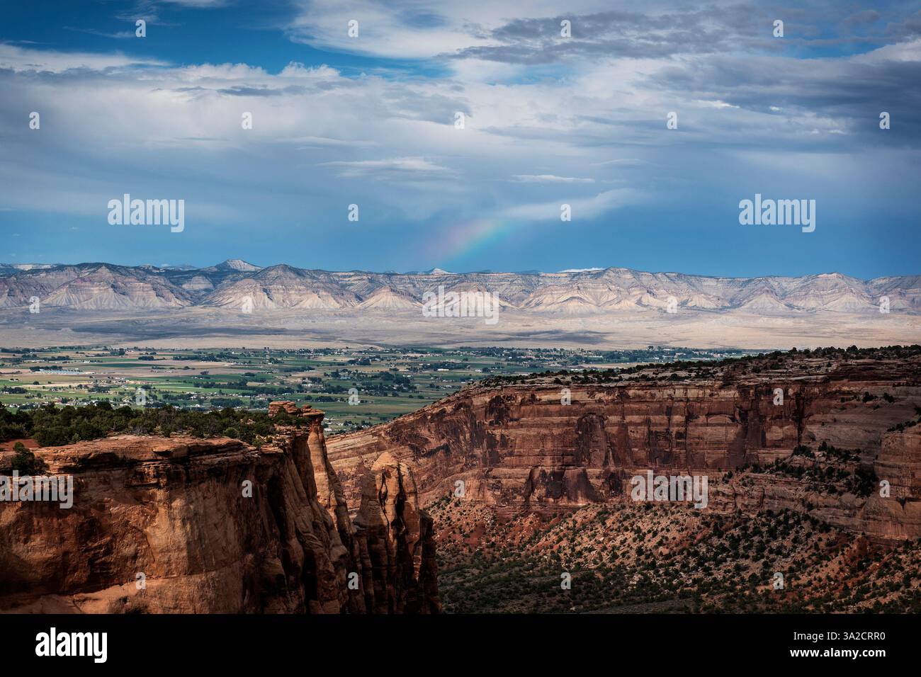 Rainbow over mountains in west colorado Stock Photo - Alamy