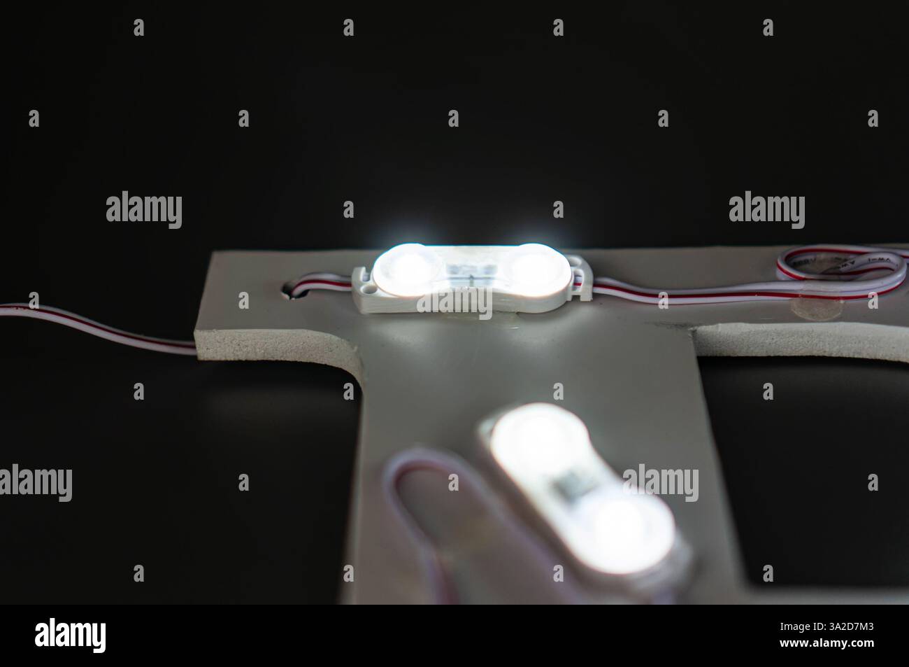Glowing LEDs on the back of a lighted letter used to make advertising ...