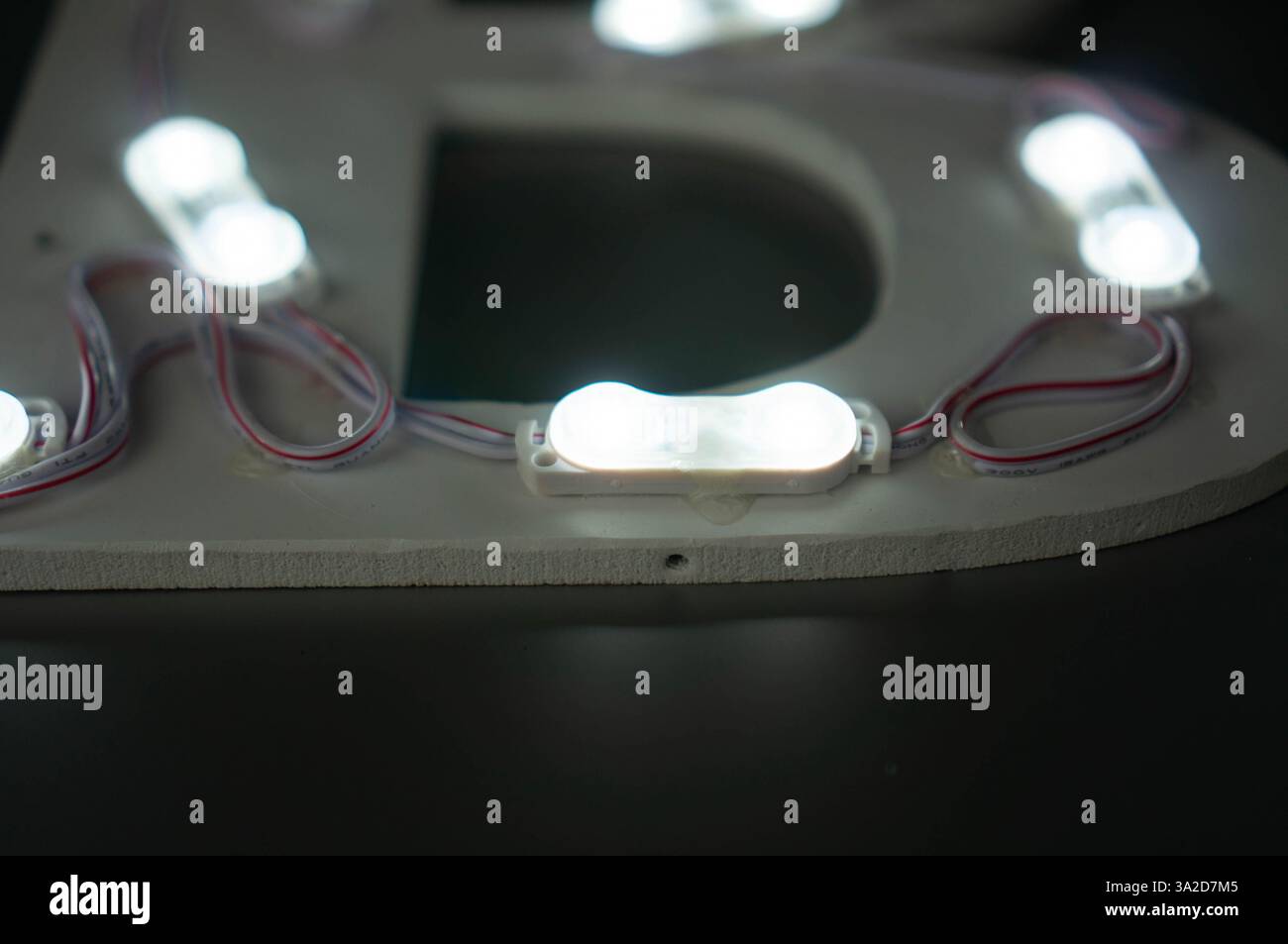 Glowing LEDs on the back of a lighted letter used to make advertising ...