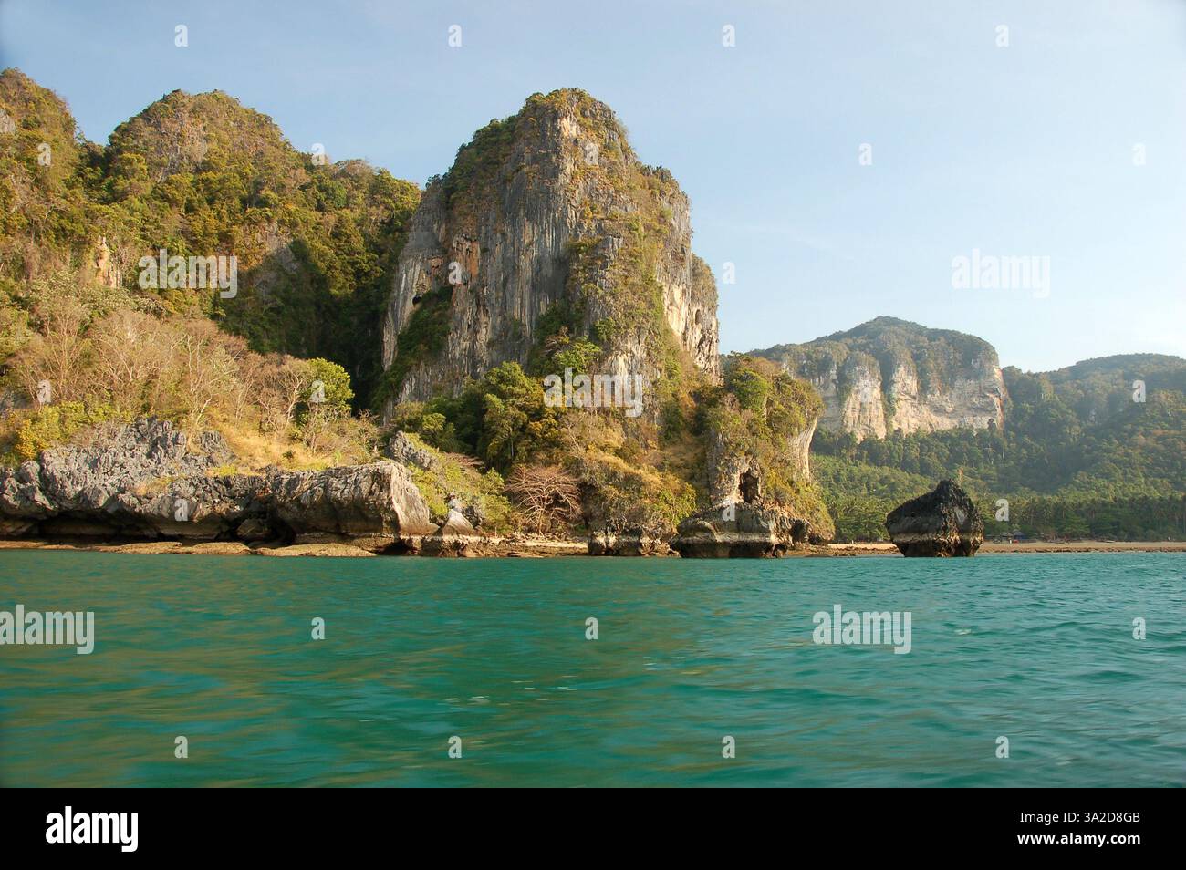 Limestone karst islands of Hong Island rise from the turquoise waters ...