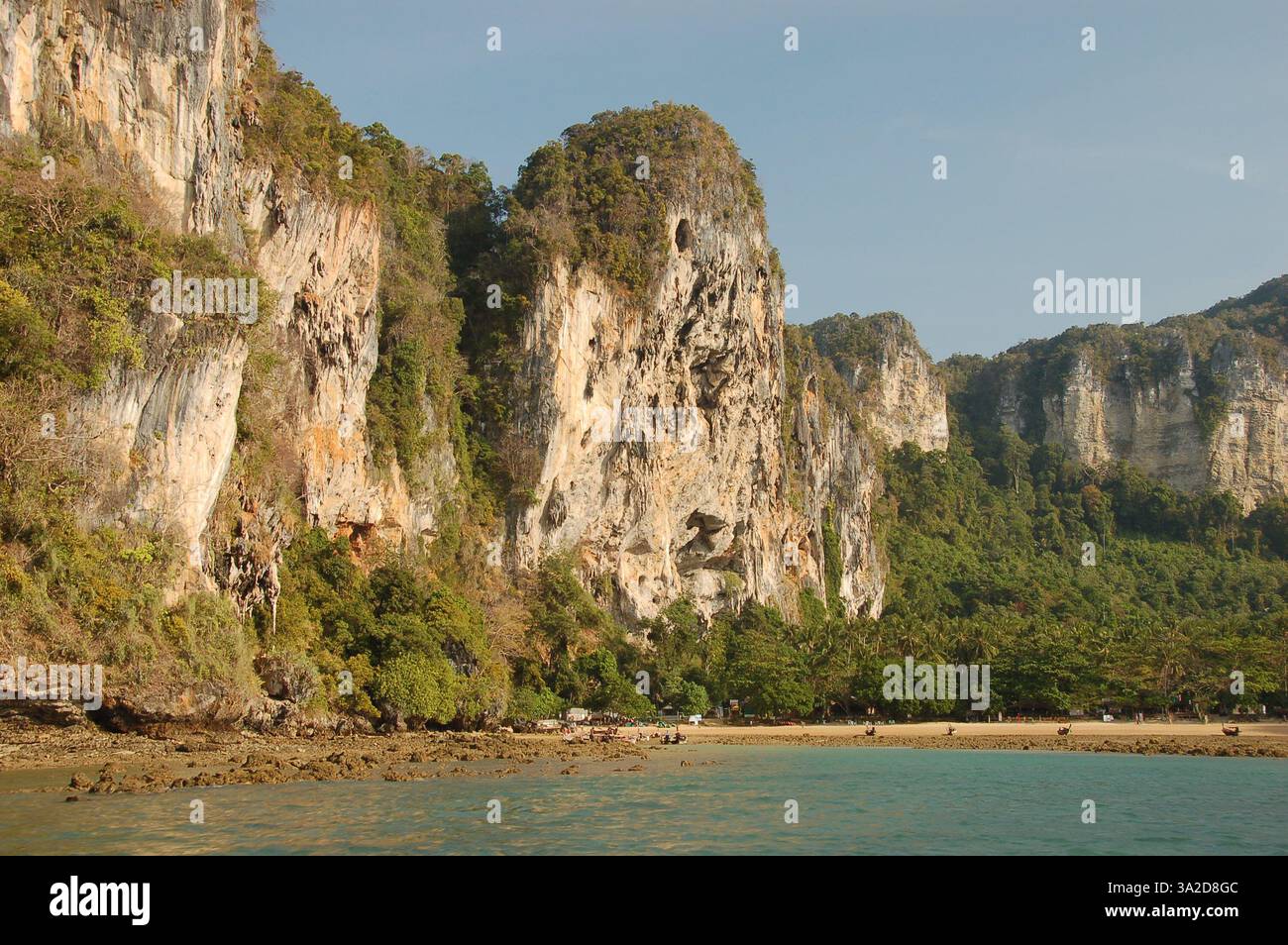 Limestone karst islands of Hong Island rise from the turquoise waters ...