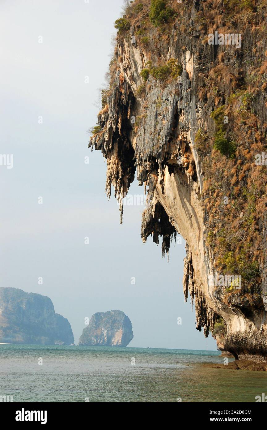 Limestone karst islands of Hong Island rise from the turquoise waters ...