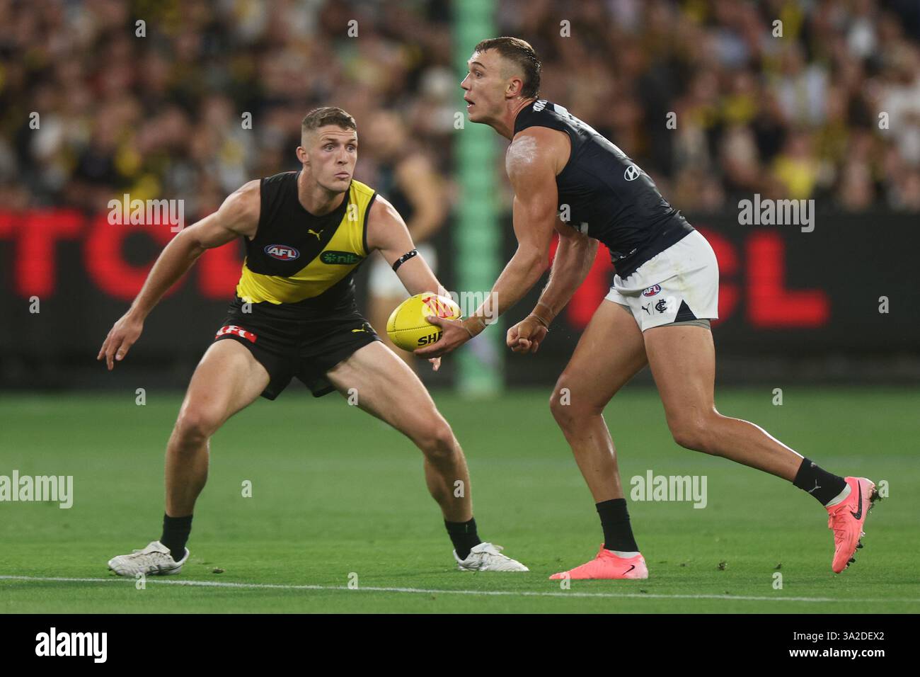 Melbourne, Australia. 13th Mar, 2025. Patrick Cripps of the Blues handballs during the AFL Round ...
