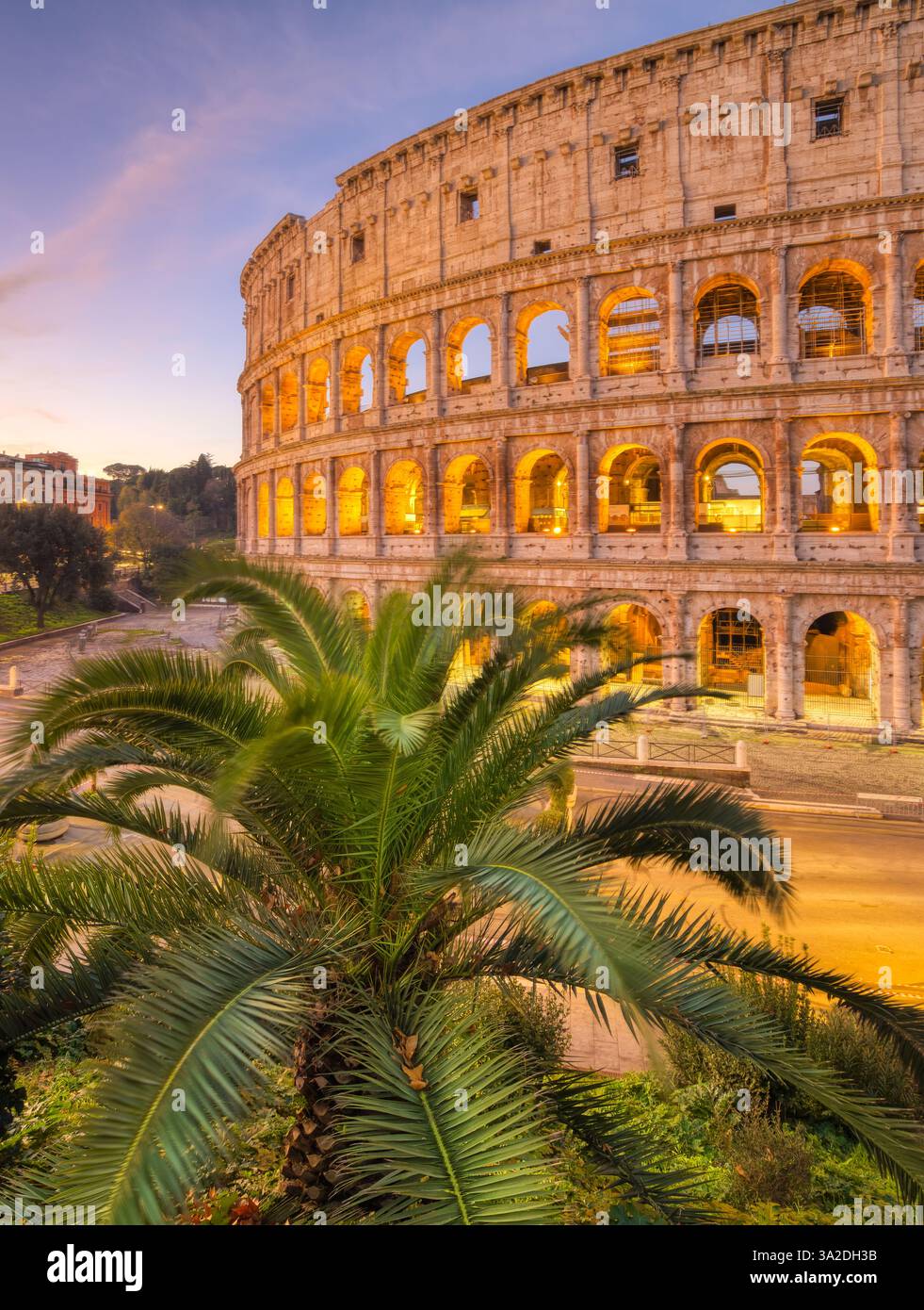 The amphitheater the Colosseum in Rome, Italy in the evening with ...