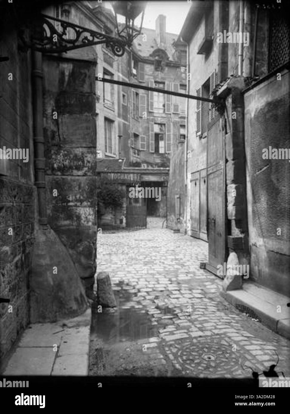 This 1910 photograph captures the courtyard of the Cour de Rohan ...