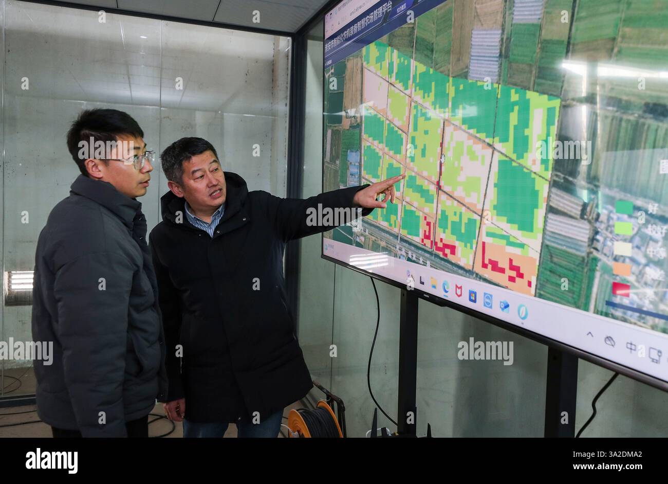 HUAI'AN, CHINA - MARCH 13, 2025 - Technicians analyze wheat growth ...