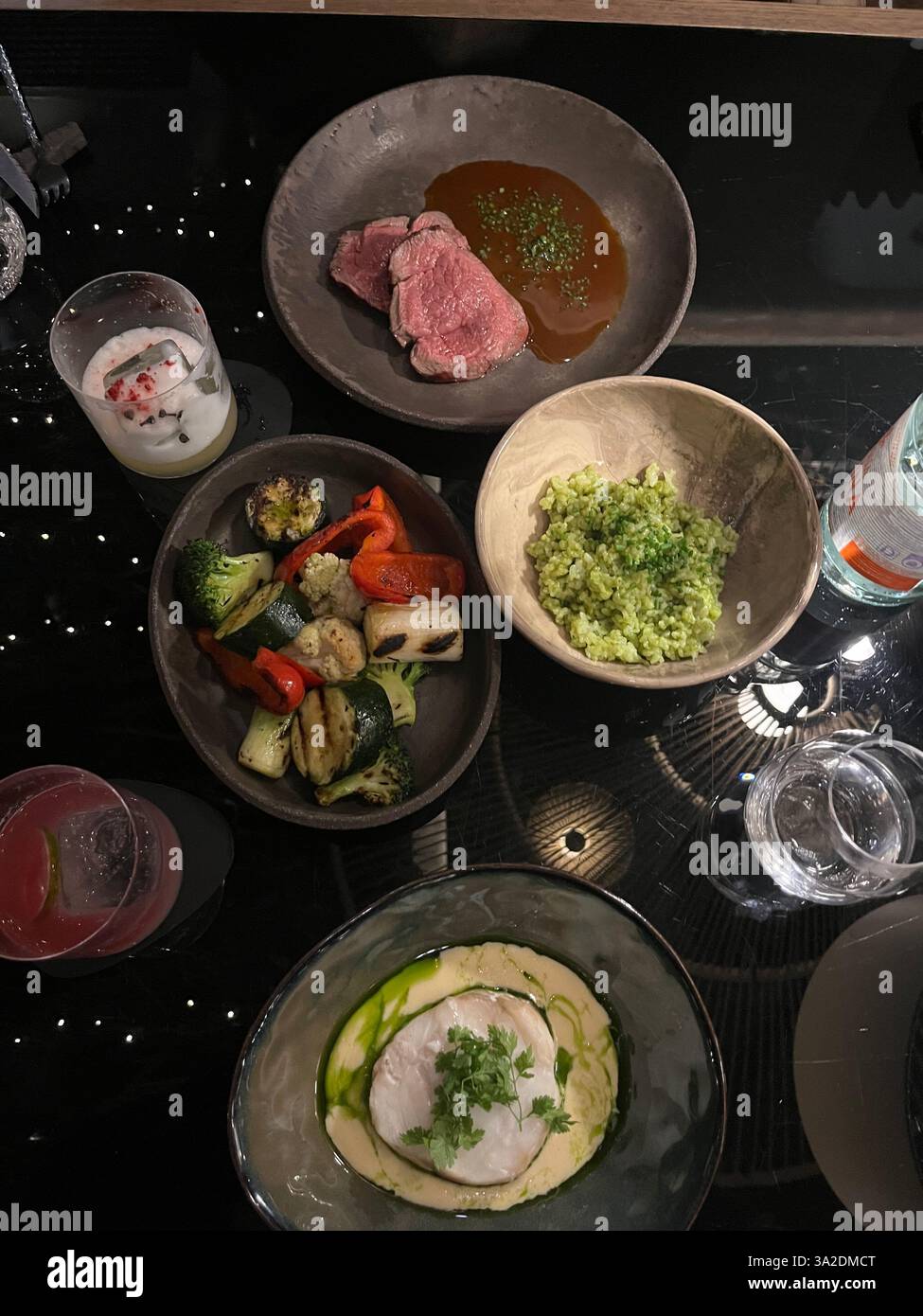 A luxurious restaurant setting featuring exquisite dishes – a perfectly ...