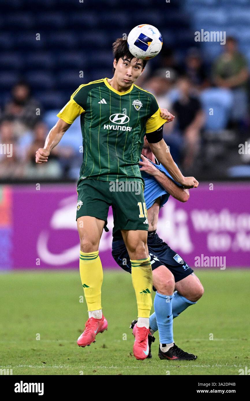 Bak Jae-Yong of Jeonbuk competes to head the ball with Rhyan Grant of ...