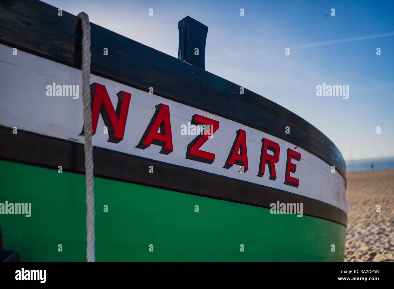Traditional historical fishing boats on Nazare Beach, Portugal Stock ...