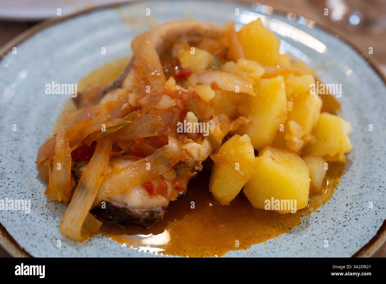 Traditional Portuguese fish stew on restaurant table Stock Photo - Alamy