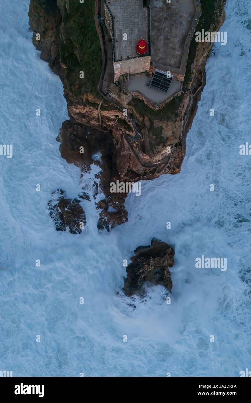 Aerial view of the The Nazare Lighthouse - Farol de Nazare -, where ...