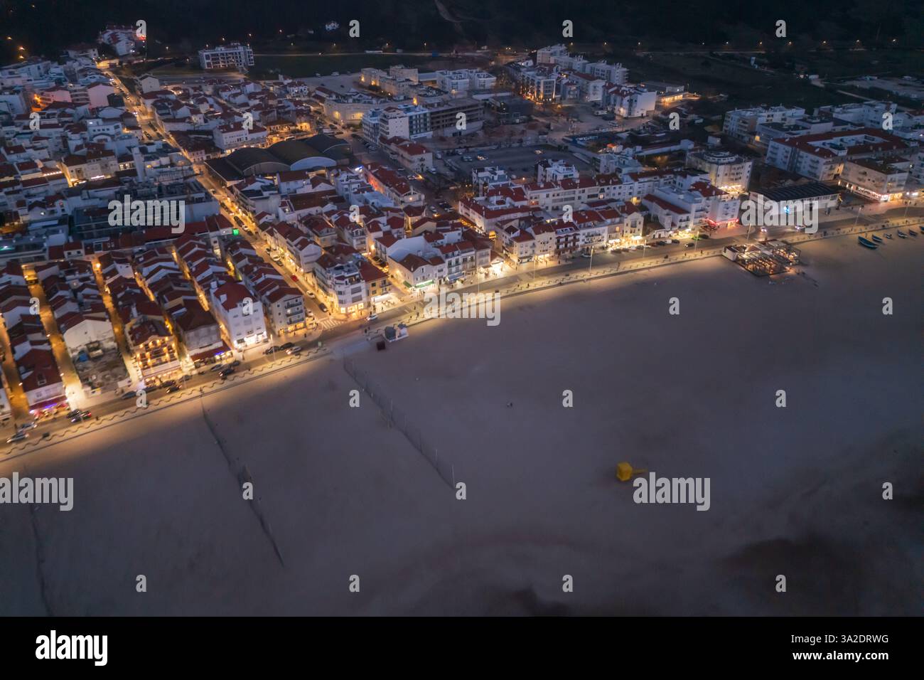Aerial view of Nazare beach and cityscape at night, Portugal Stock ...