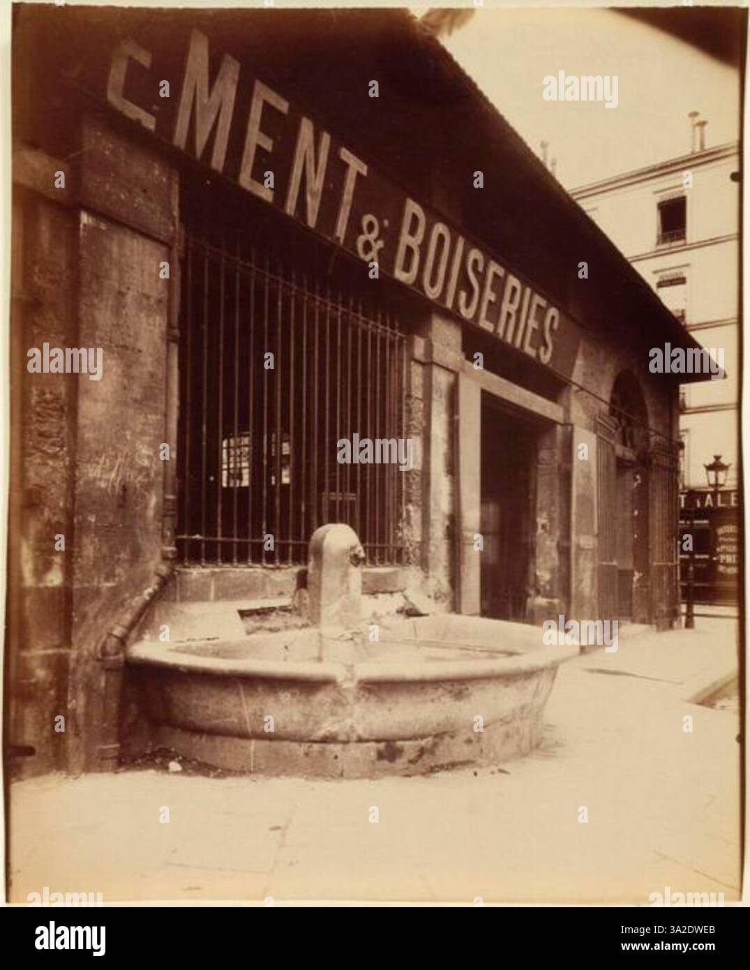 This photograph shows the demolished fountain at Marché Popincourt in ...