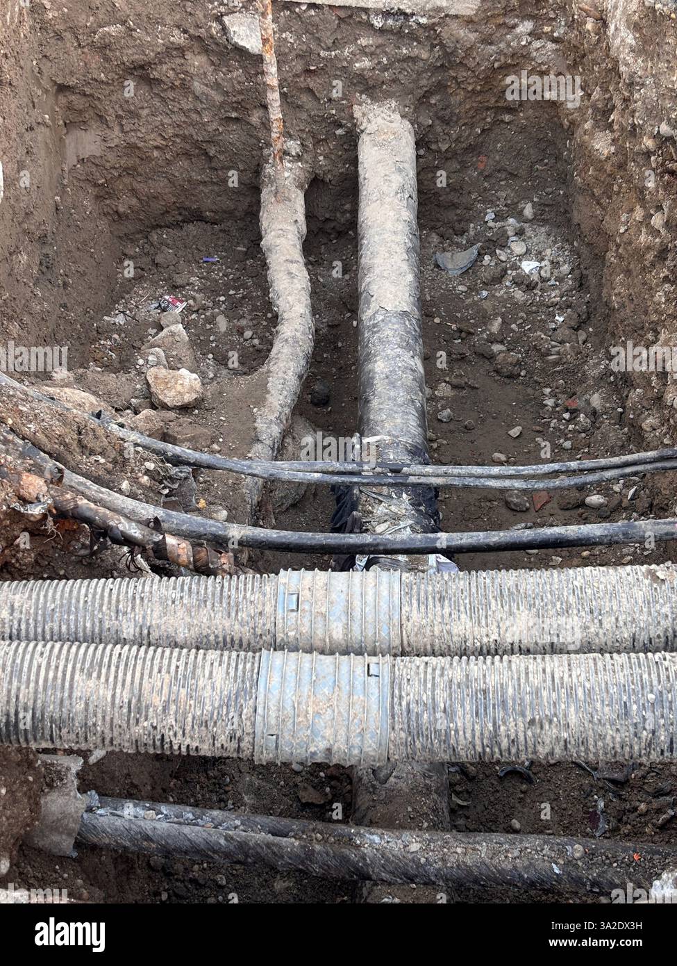 Pipes and communication cables in trench, underground utility systems ...