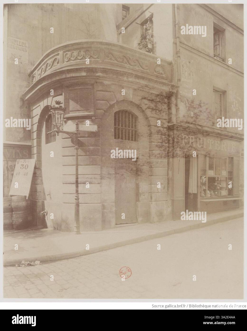 This photograph by Eugène Atget captures the Fontaine du Pot de Fer St ...