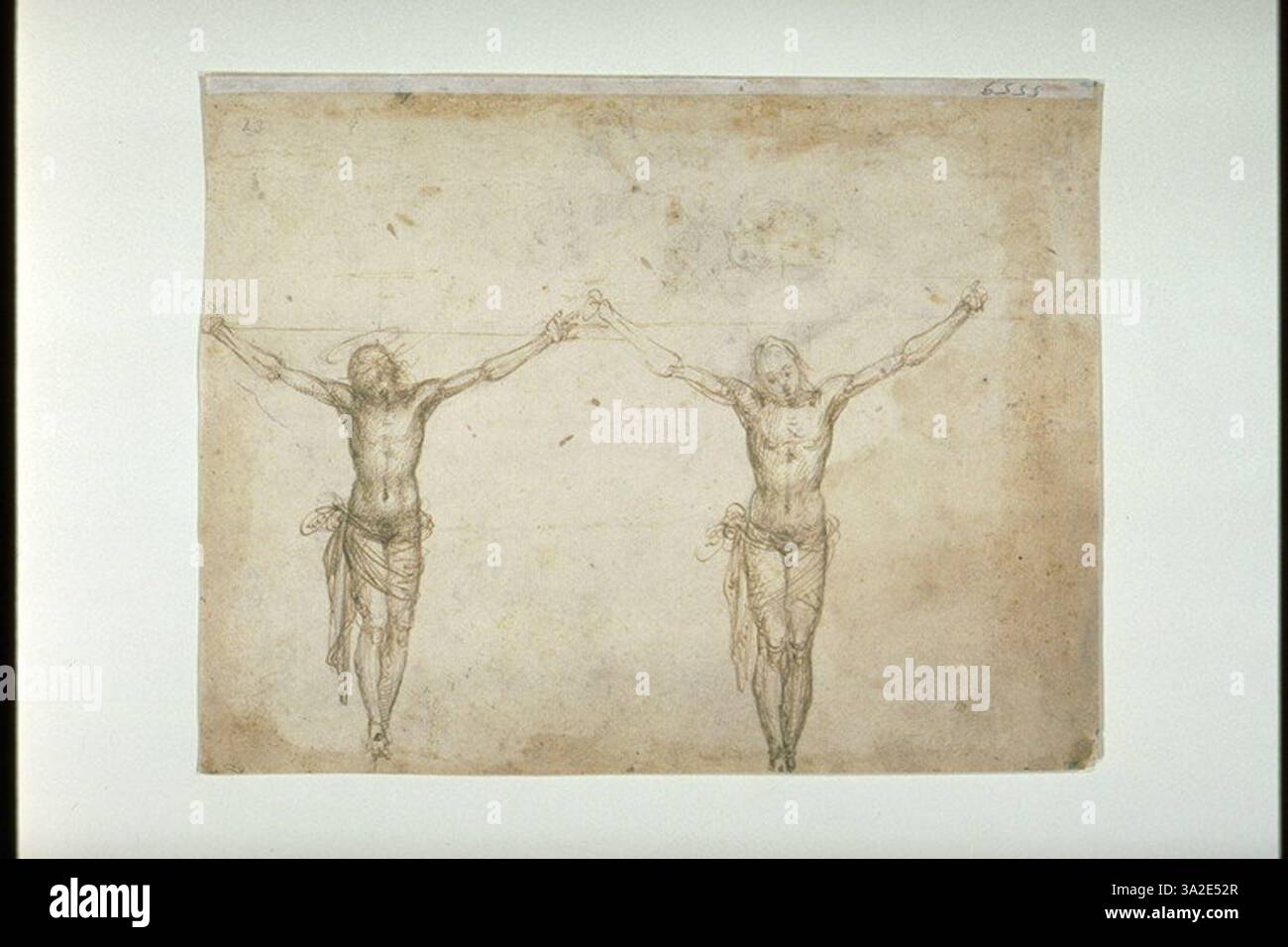 This verso study depicts two different poses of the crucified Christ ...
