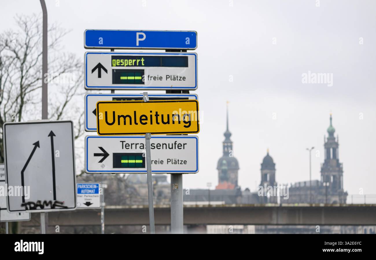 13 March 2025, Saxony, Dresden: Signs for detours and parking spaces ...