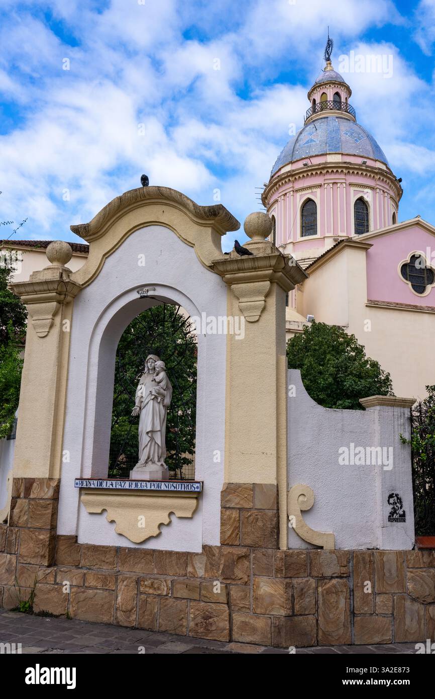 A statue of Mary and the dome of the Cathedral of Salta in Salta ...