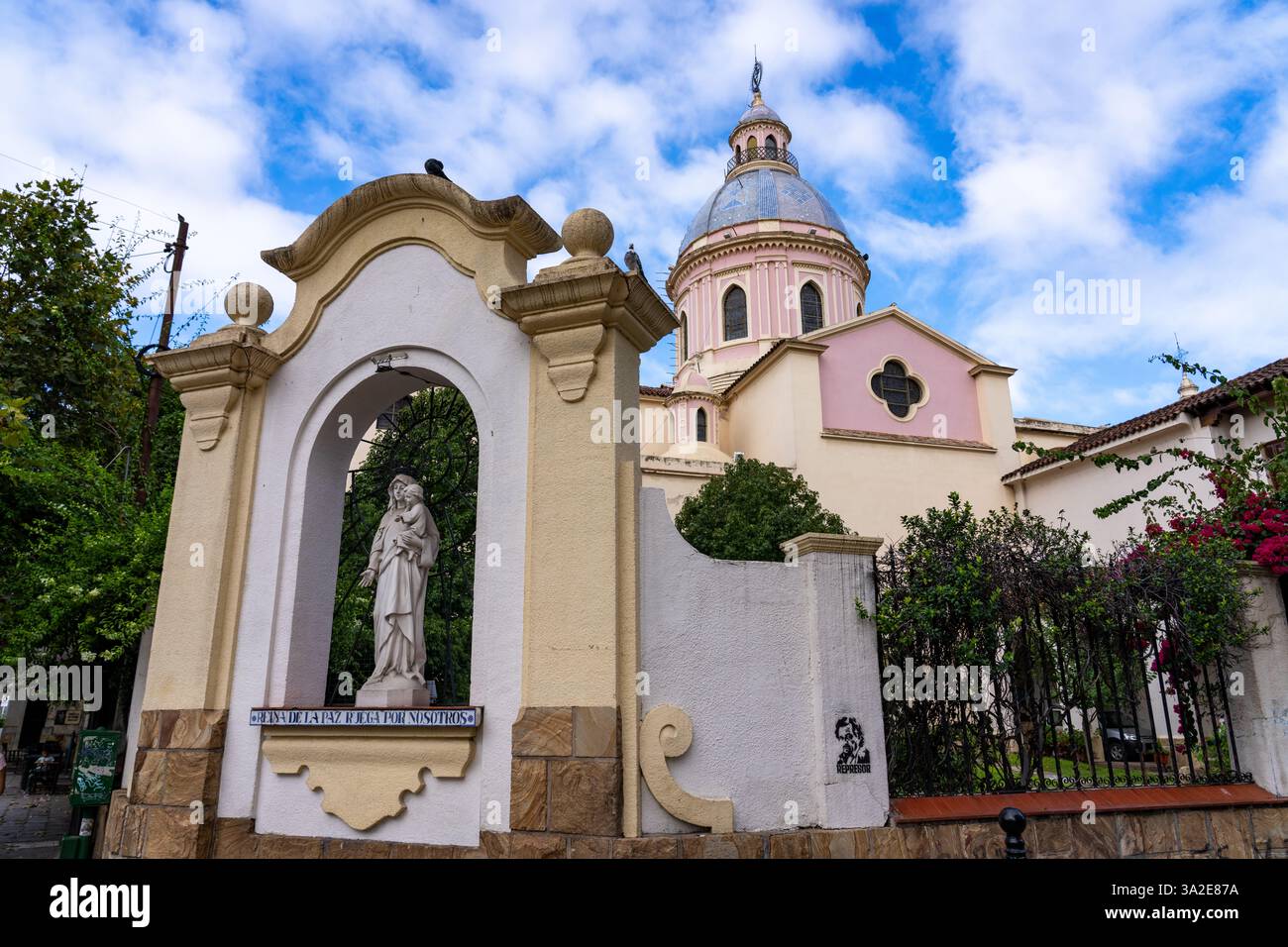 A statue of Mary and the dome of the Cathedral of Salta in Salta ...