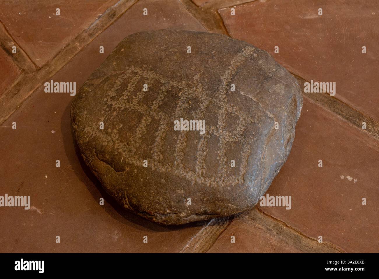 Pre-Hispanic indigenous Amerindian petroglyphs carved on a stone in the ...