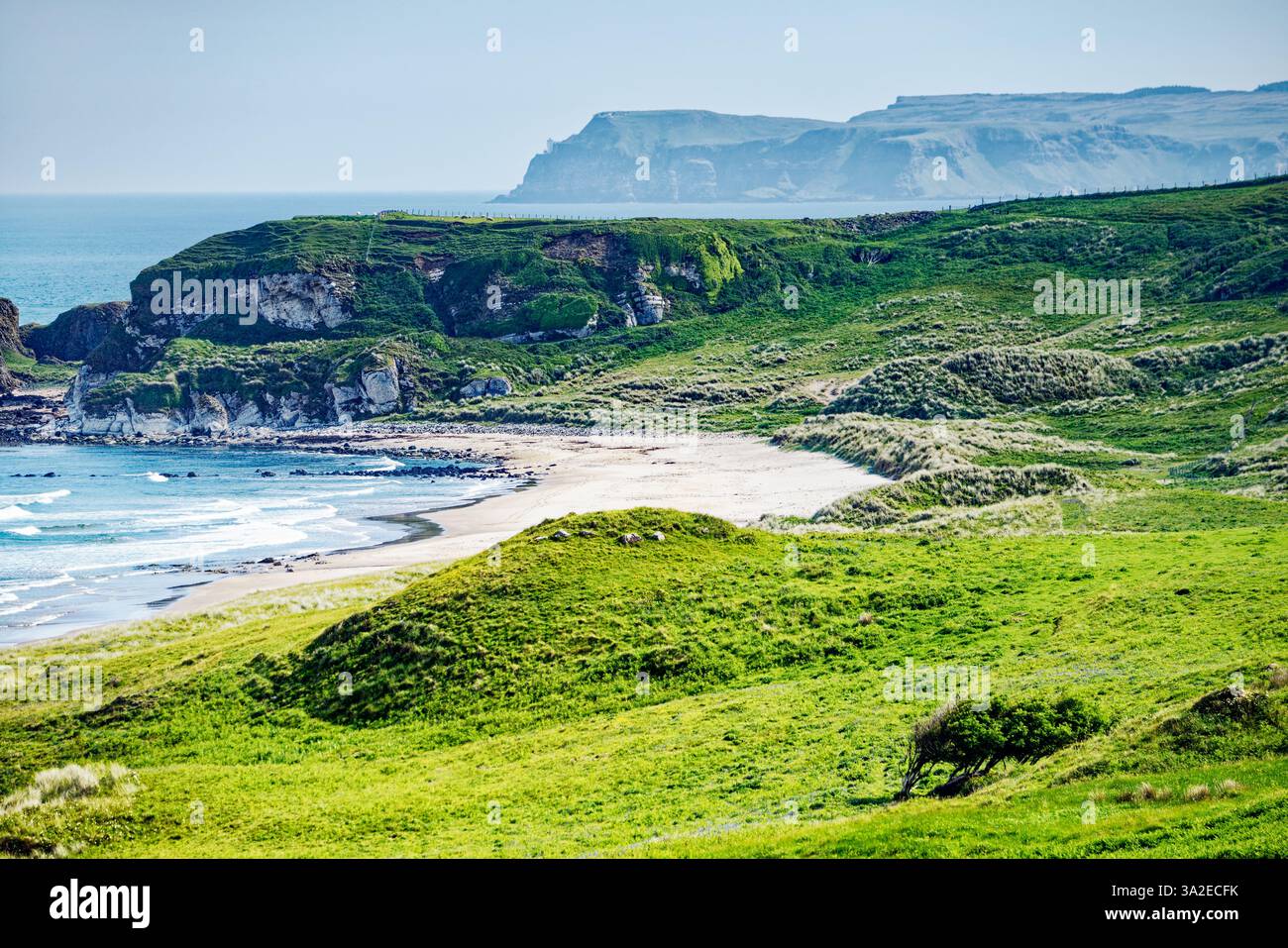 White Park Bay on north Antrim coast, Northern Ireland. Central mound ...