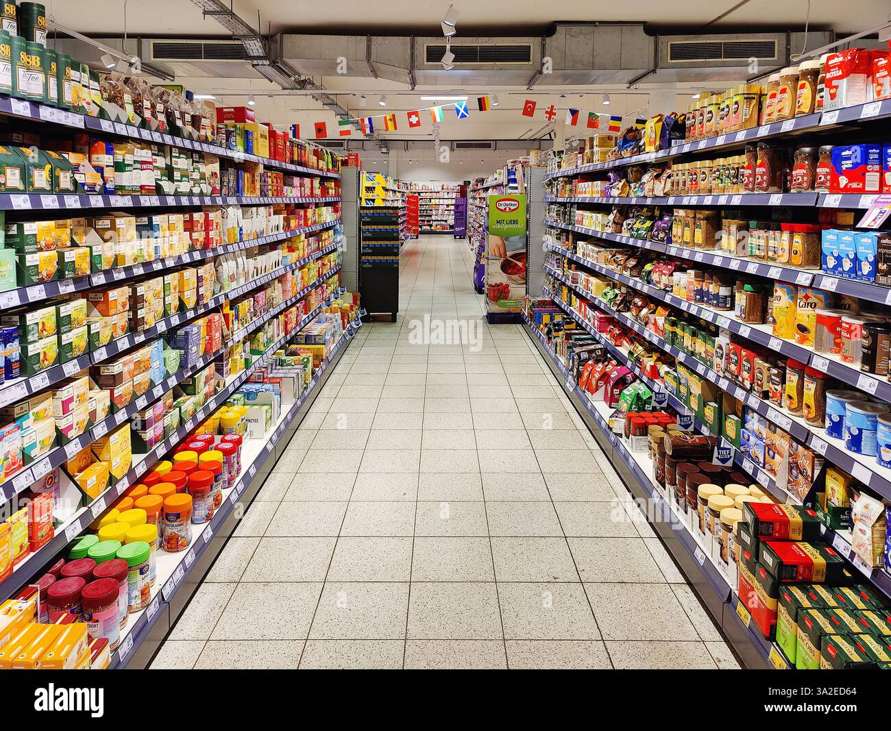 Supermarket aisle with full shelves, Germany Stock Photo - Alamy