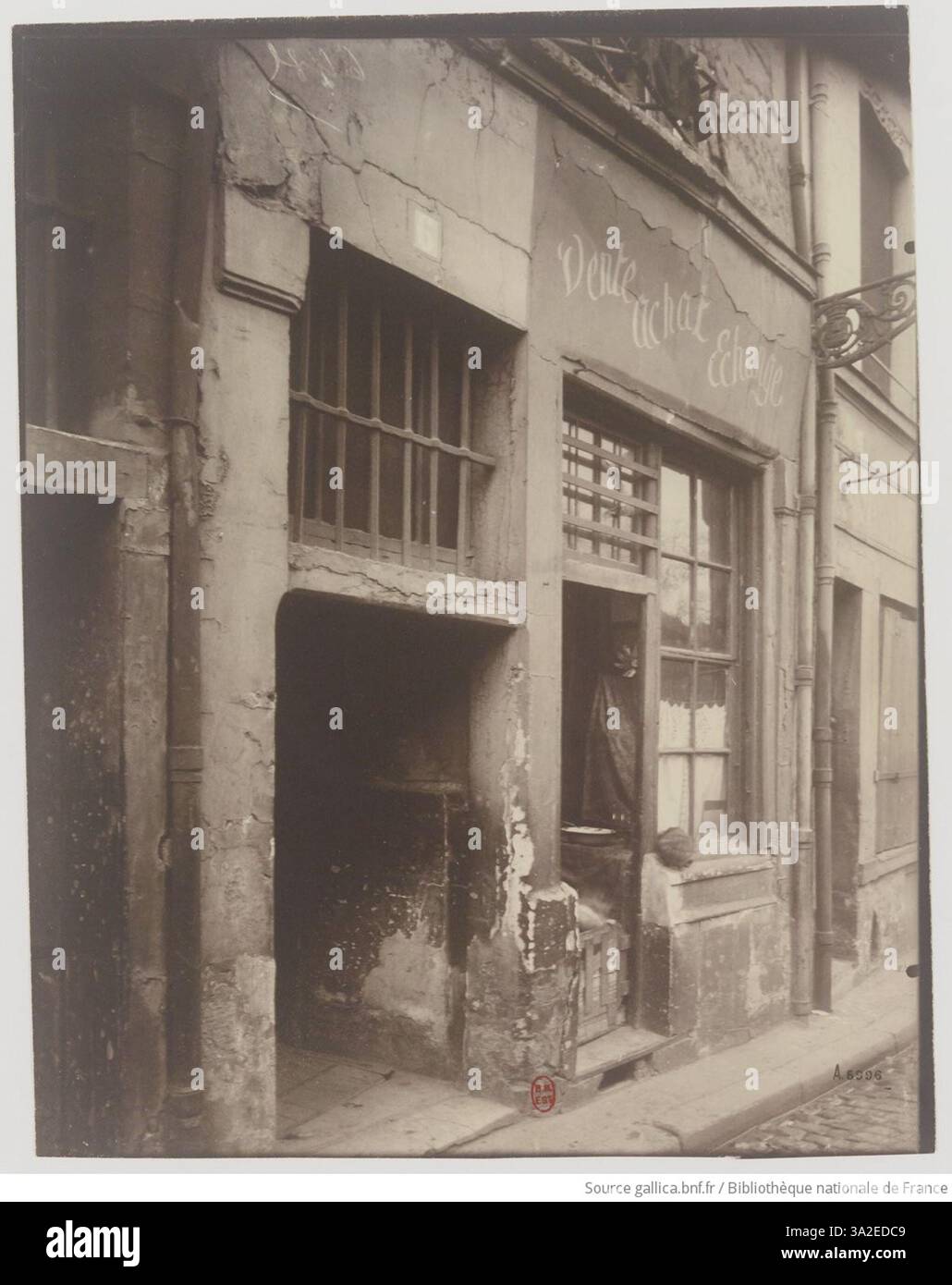 This image by Eugène Atget captures a boutique on Rue Saint-Julien le ...